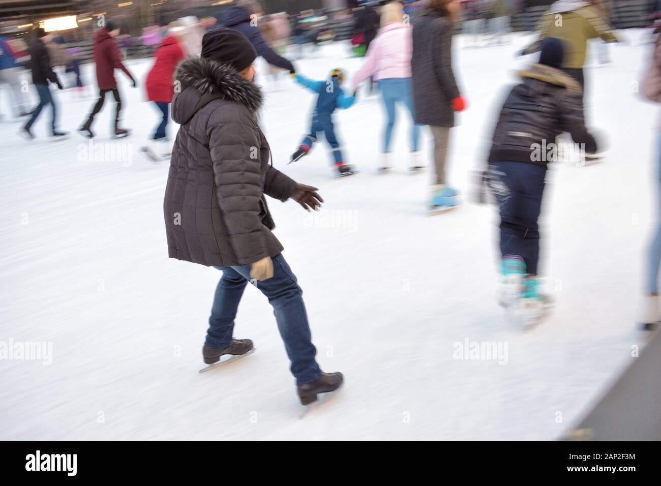 Skating on the ice rink.It's good for your health Stock Photo - Alamy