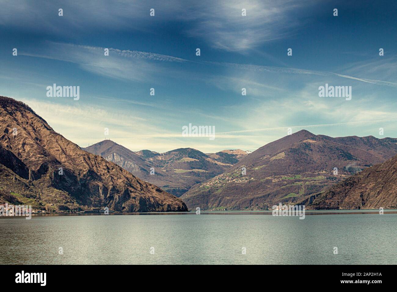 Beautiful city landscape with lake and mountains Stock Photo - Alamy
