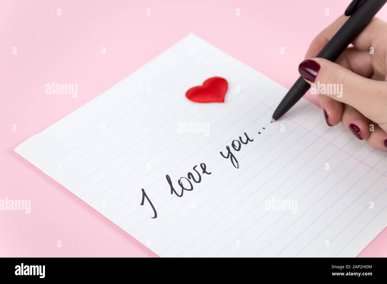 female hand writes a declaration of love on paper Stock Photo - Alamy