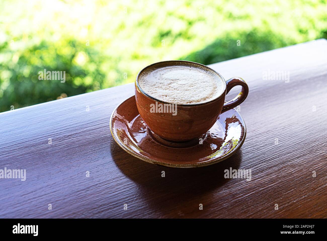 Cup of coffee on tropical background. Tropical travel concept. Close up ...
