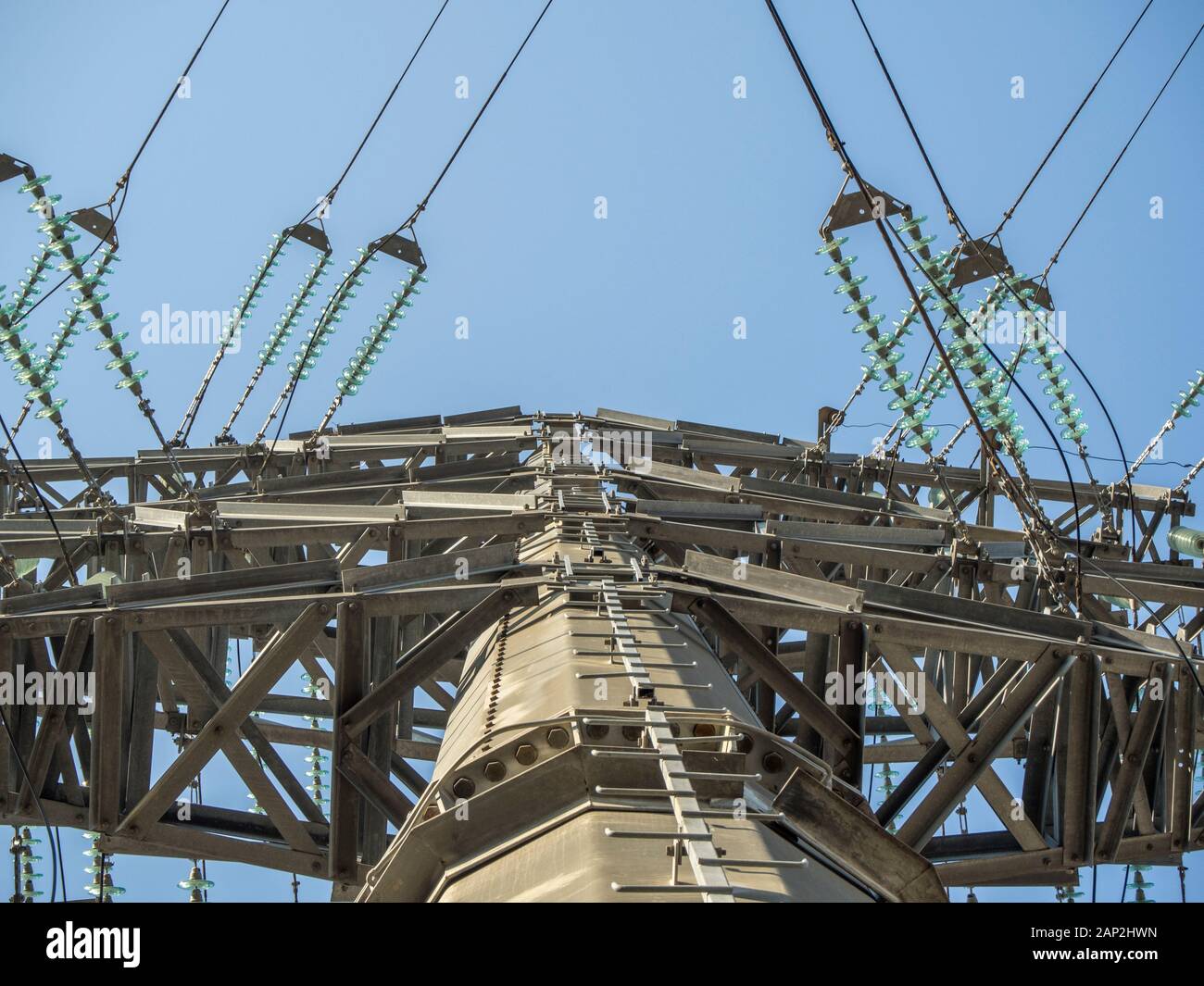 Large electric pole with wires on a blue sky background Stock Photo - Alamy