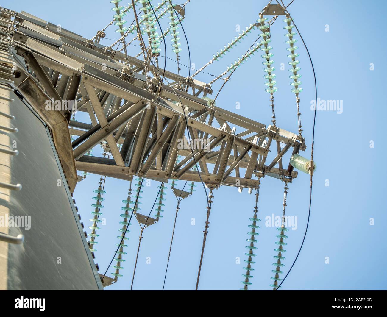 Large electric pole with wires on a blue sky background Stock Photo - Alamy