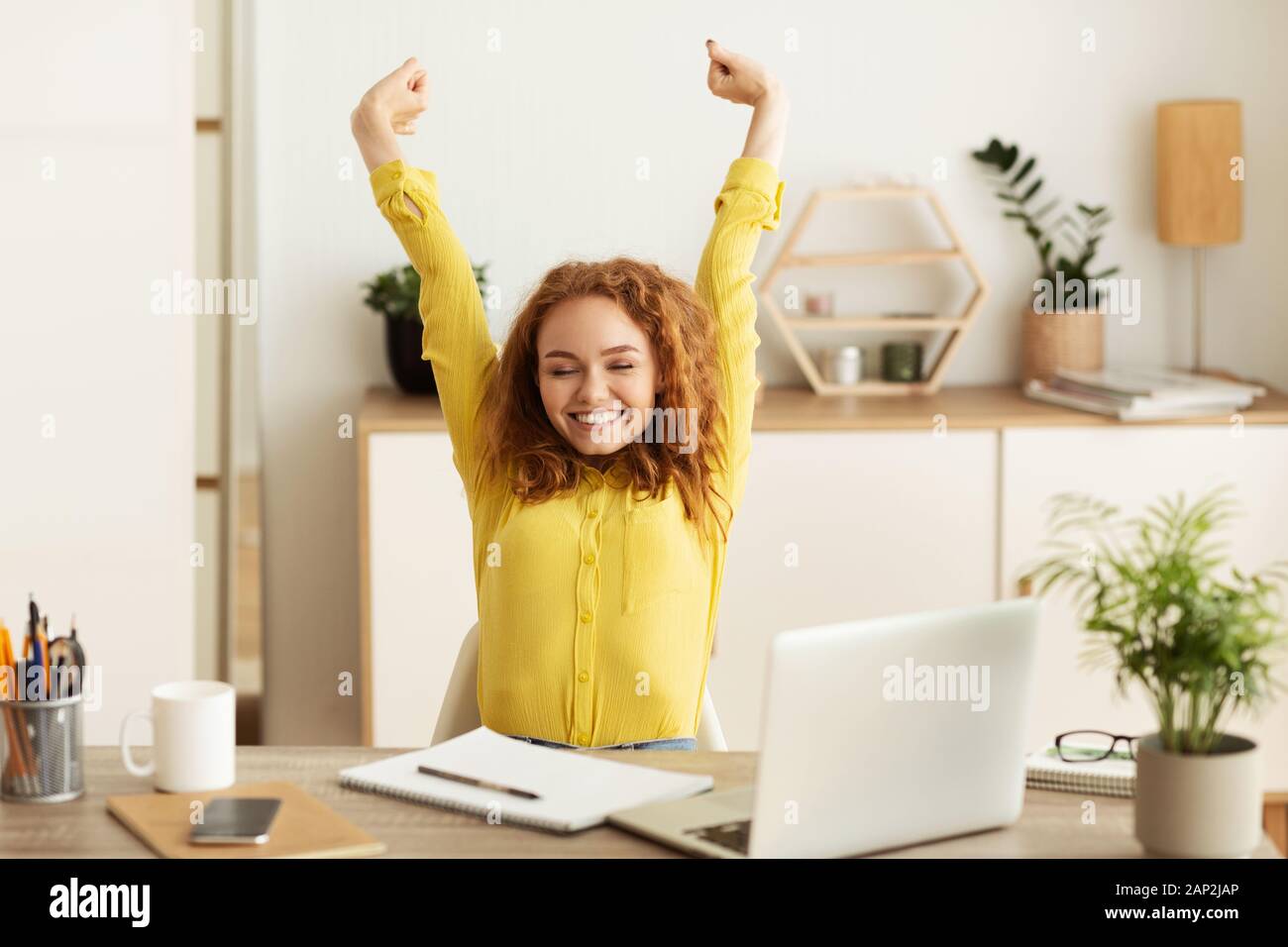 Break at work. Positive businesswoman relaxing at workplace Stock Photo ...