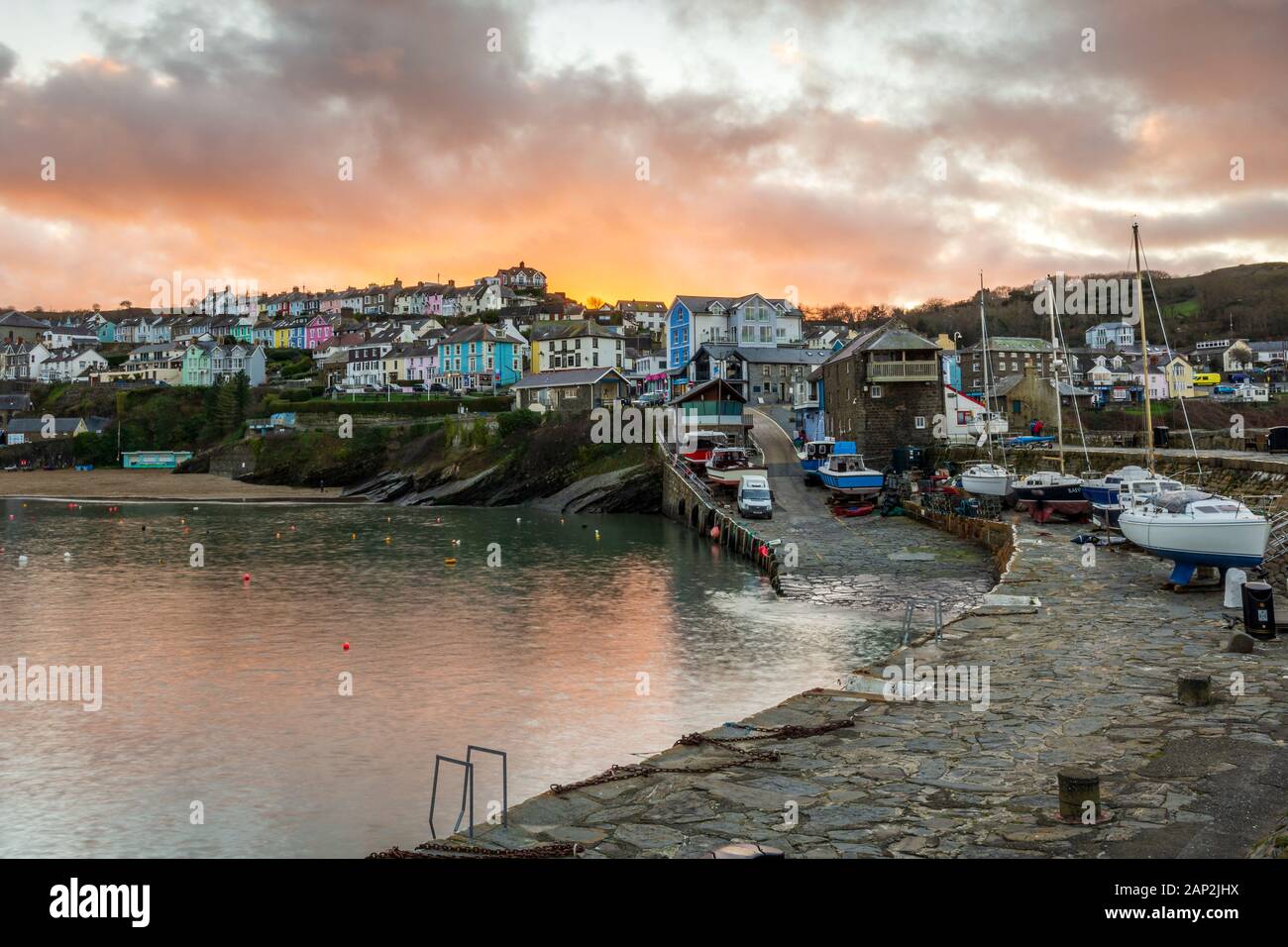 Winter sunset at the beautiful coastal Welsh village of New Quay Stock ...