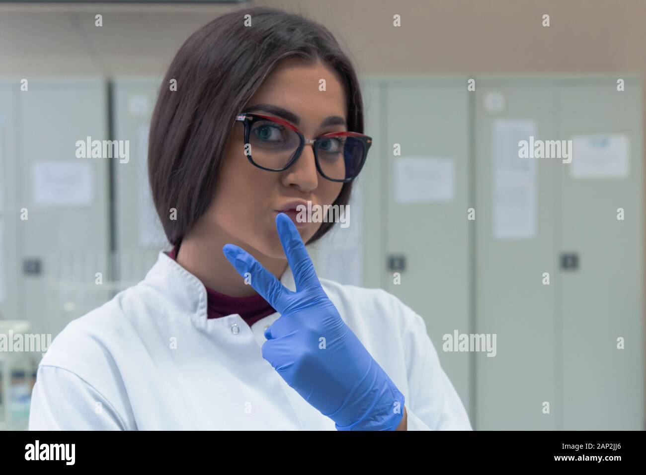Young female Laboratory scientist working at lab with test tubes, test ...