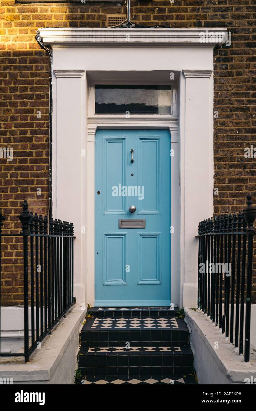 Nice traditional blue door an exclusive mews with white small houses in ...