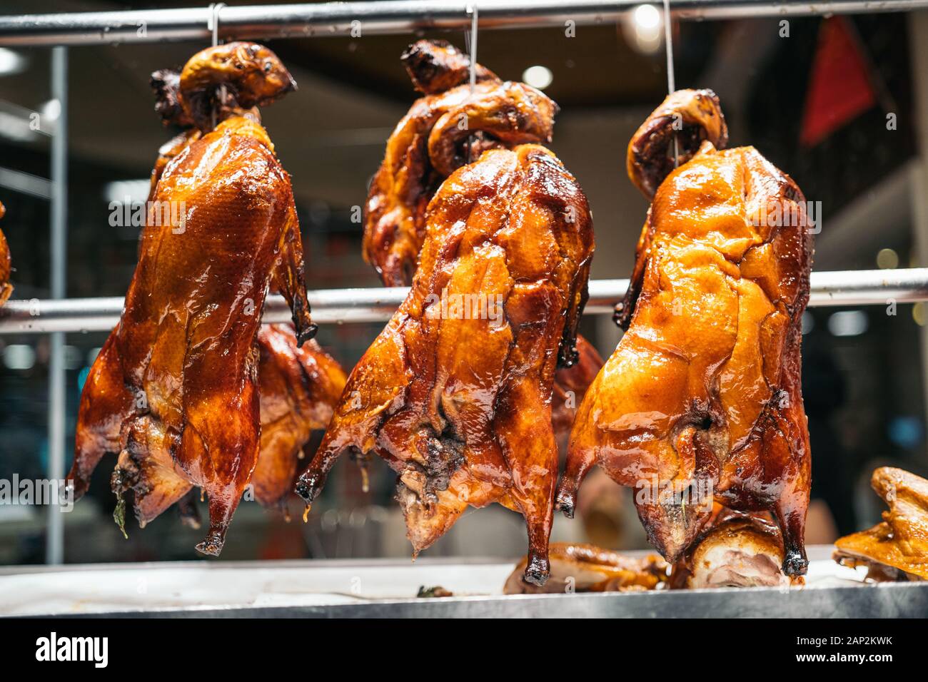 Roasted ducks hanging in window hi-res stock photography and images - Alamy