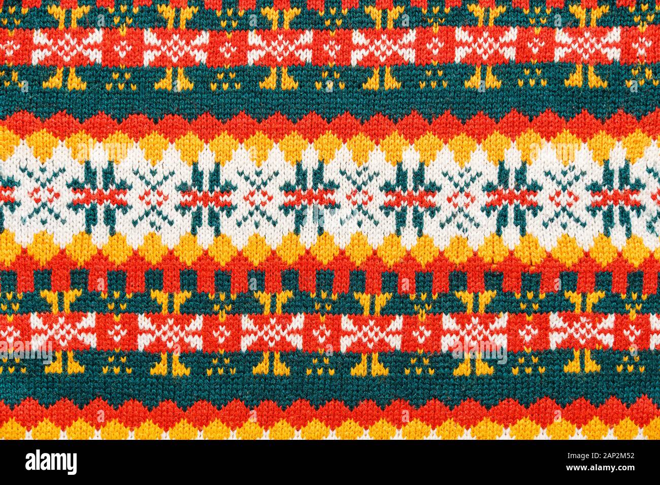 Motley christmas sweater texture with patterns. Colorful knit texture ...