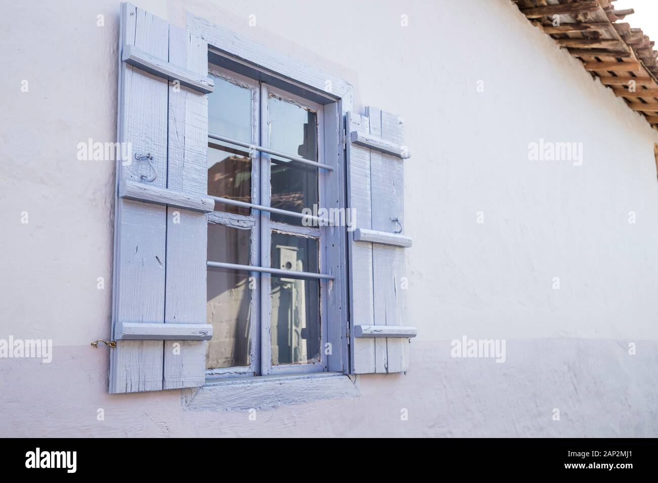 blue colored wooden window blinds of a house, outdoor Stock Photo - Alamy
