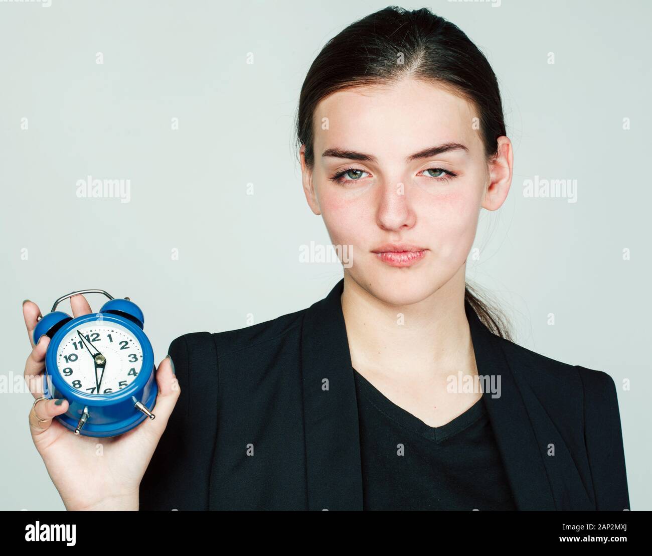 young beauty woman in business style costume waking up for work early ...