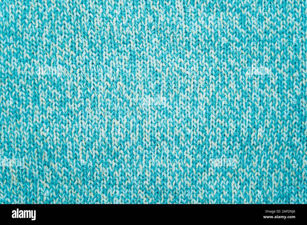 The texture of a blue turquoise knitted fabric. Sweater background ...