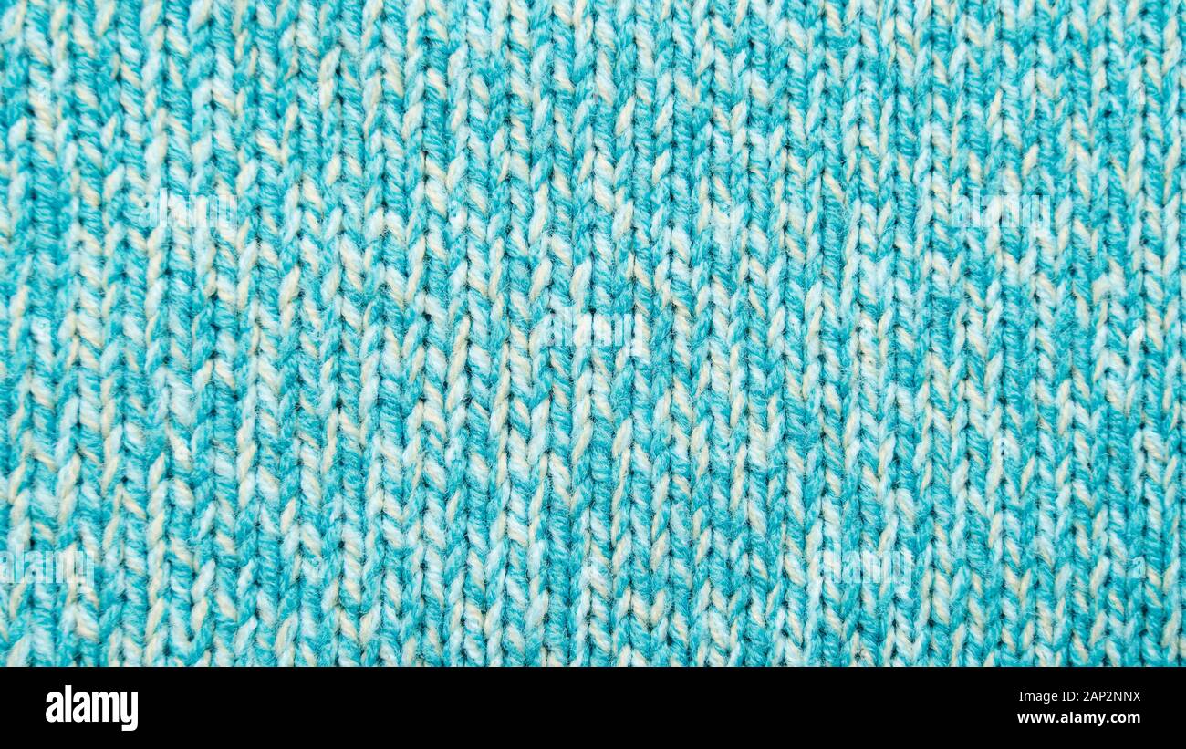The texture of a blue turquoise knitted fabric. Sweater background ...