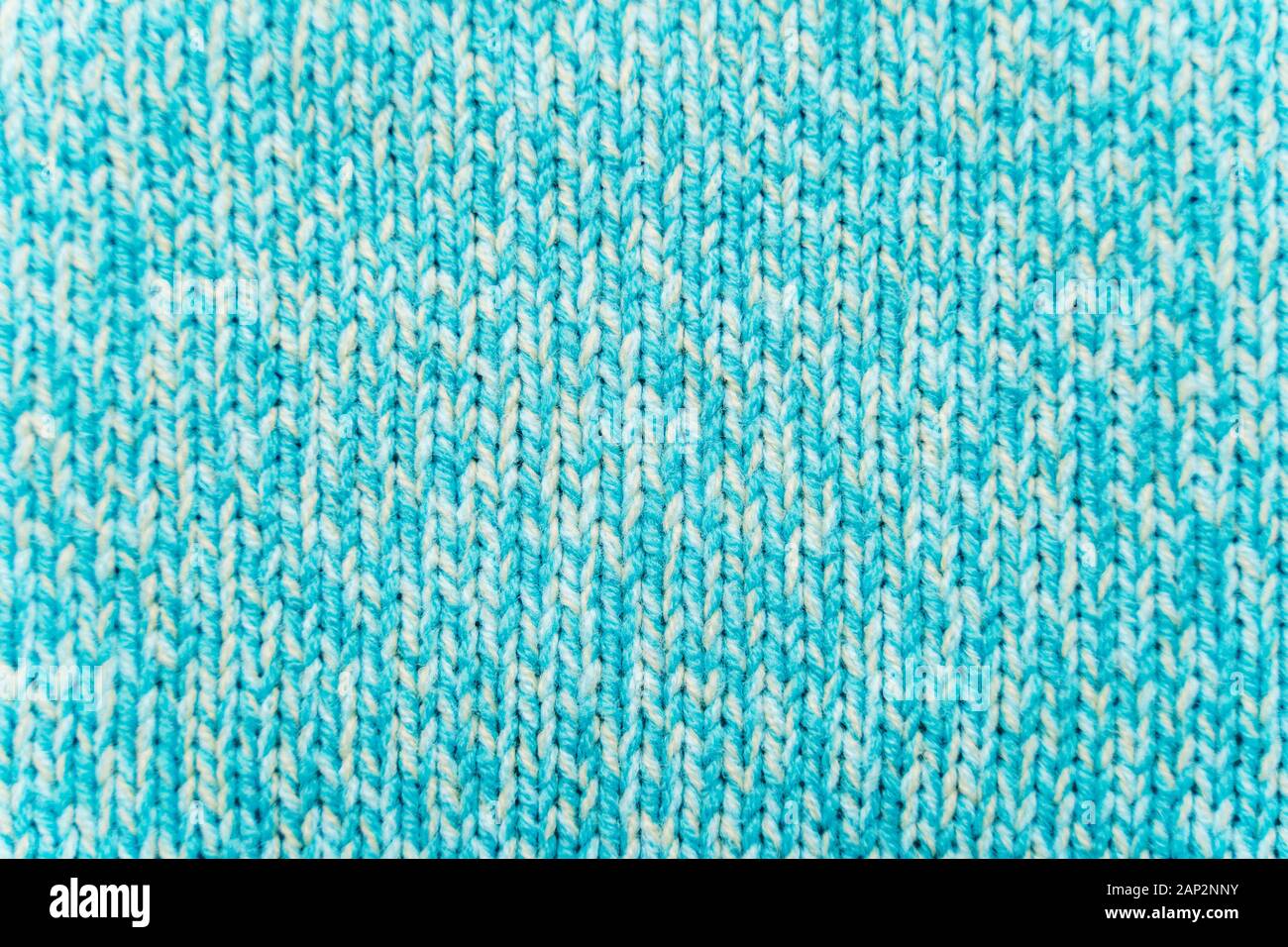 The texture of a blue turquoise knitted fabric. Sweater background ...