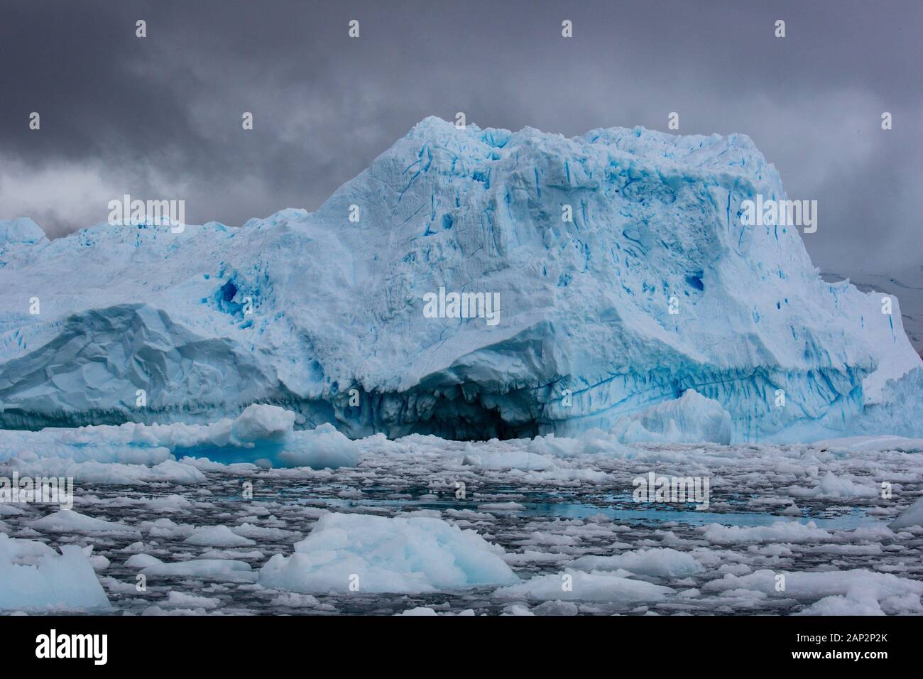Blue ice of a glacier in Antarctica. The ice of blue icebergs contains ...