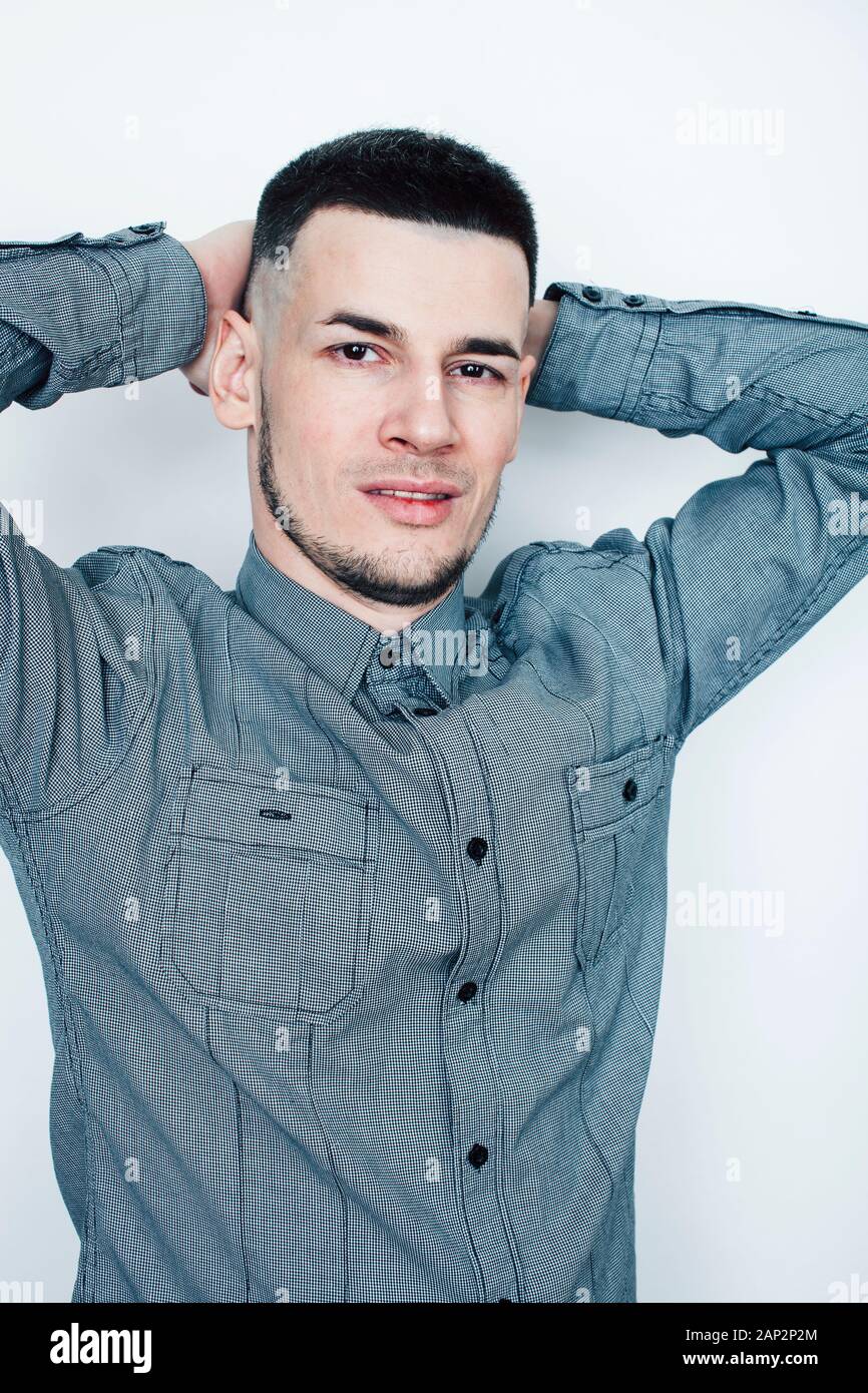 young handsome well groomed guy posing on white background gesturing ...