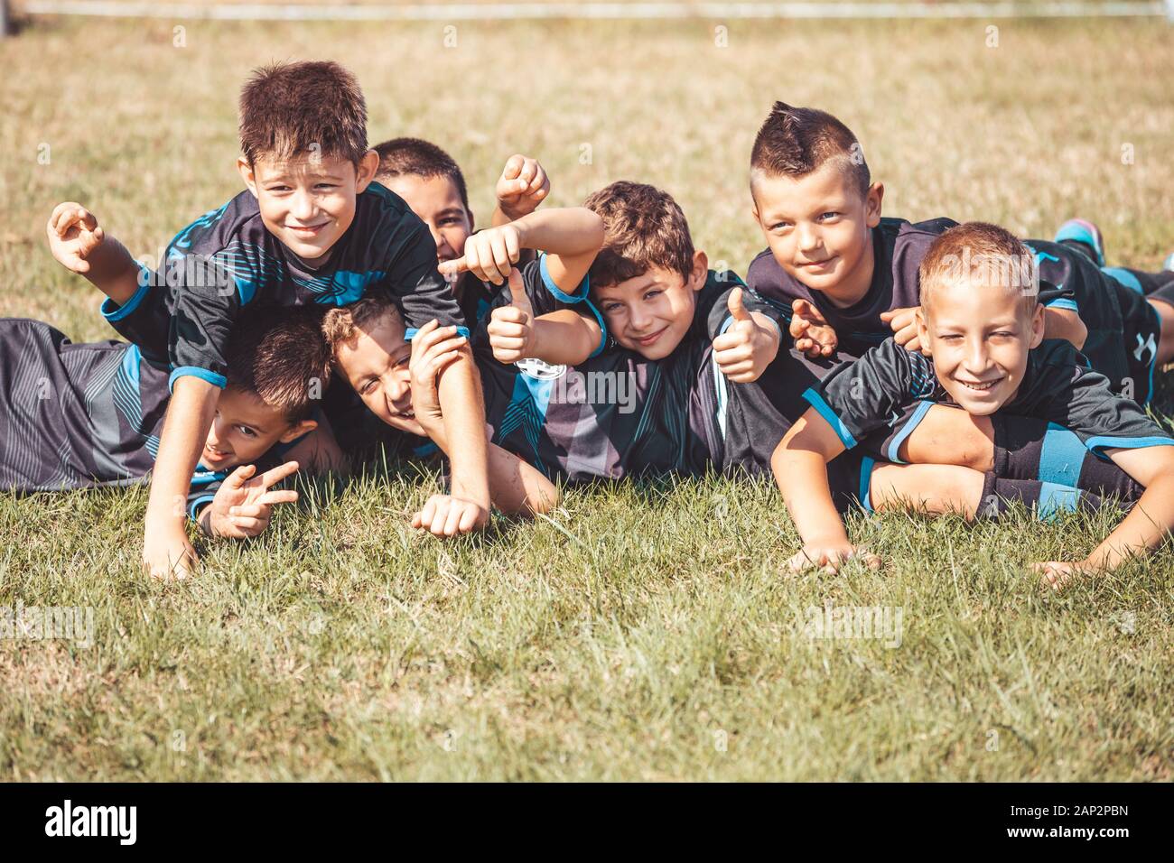 Kids soccer football - young children players celebrating victory ...