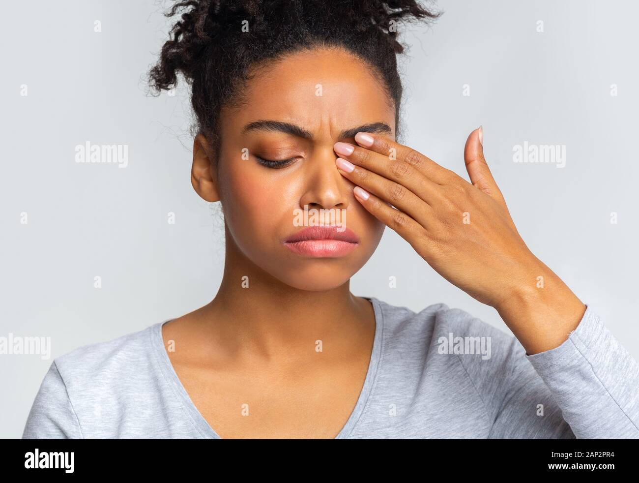 Sad black girl touching her eye, suffering from conjuctivitis Stock ...