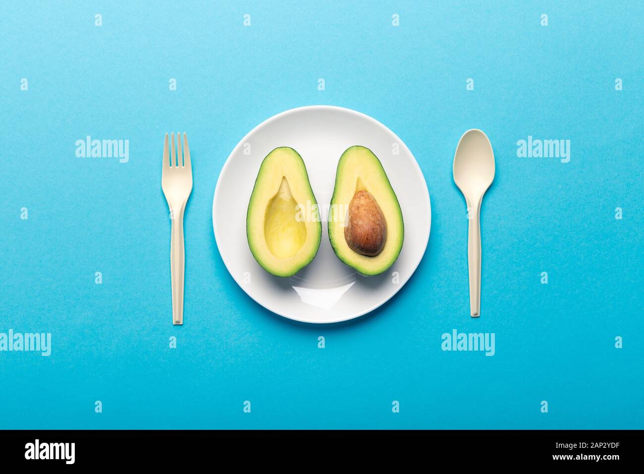 Eating avocado and getting bioplastic disposable tableware Stock Photo ...