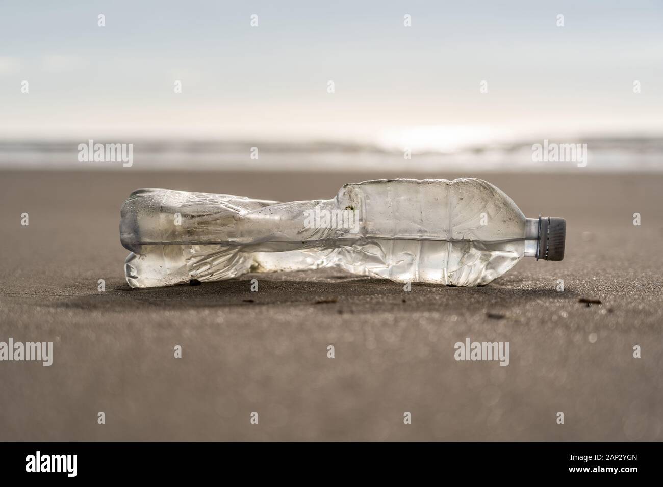 wast on the beach of Venice Italy Europe. Plastic bottle on a beach in ...