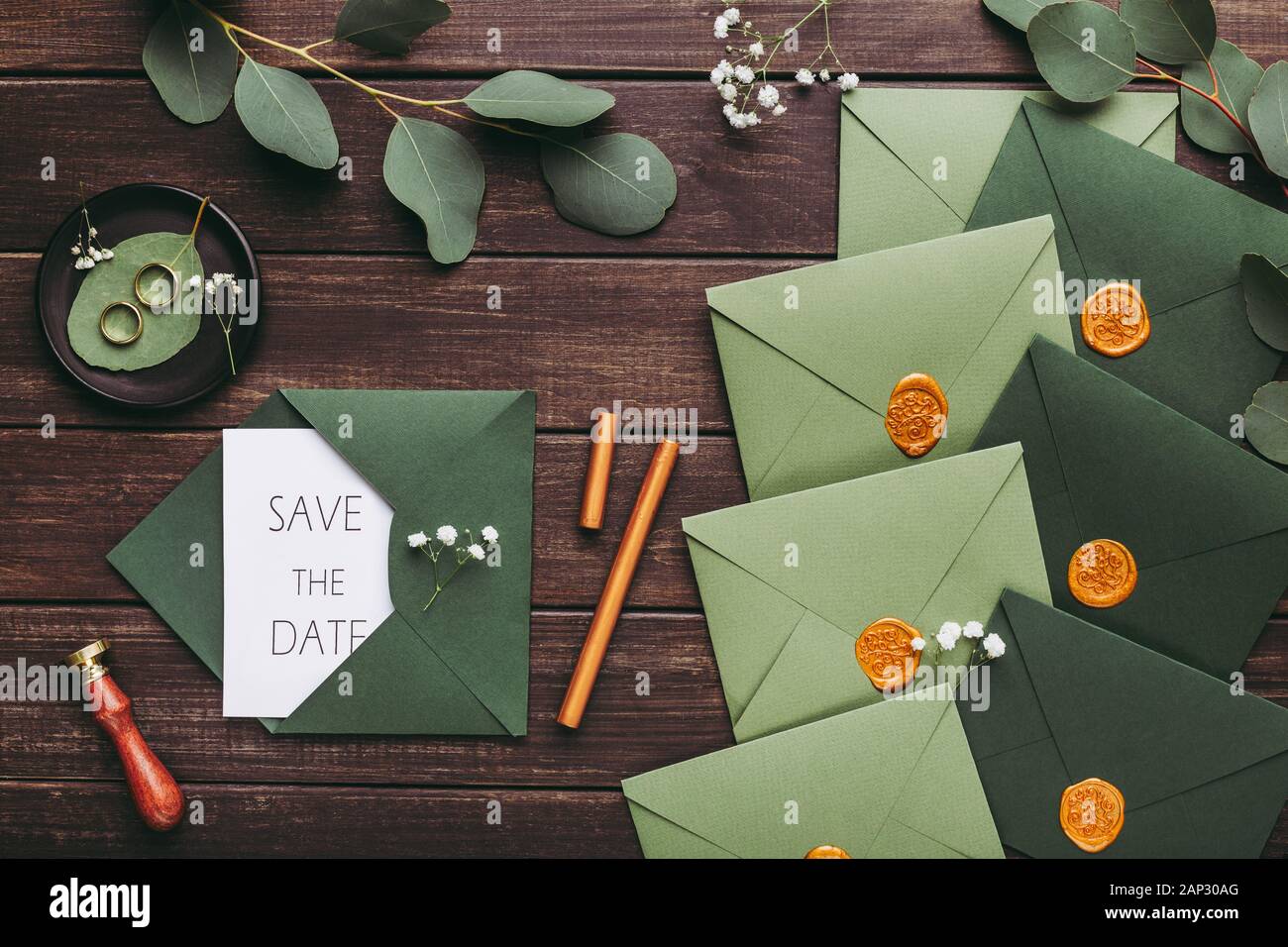 Green modern envelopes with creative wedding invitations Stock Photo ...