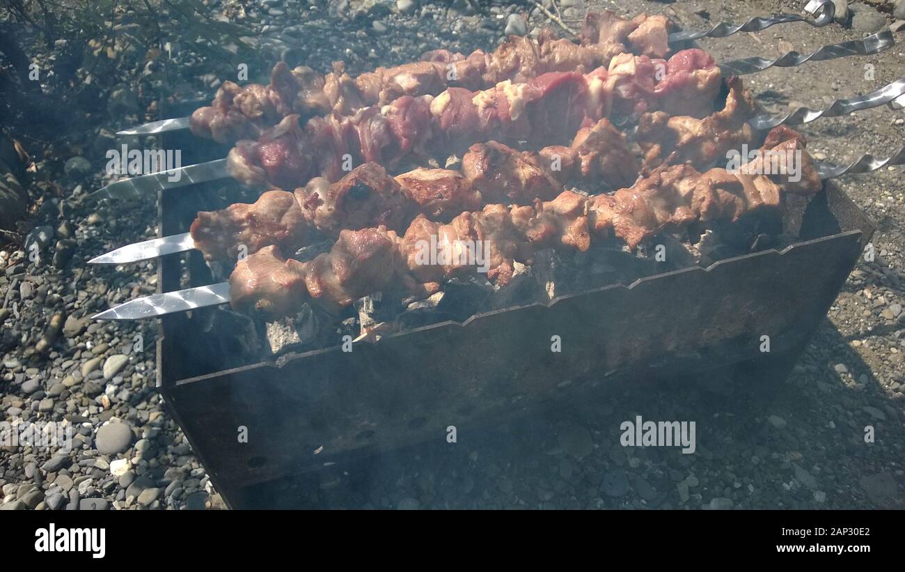 Shish kebab from pig meat on skewers Stock Photo - Alamy
