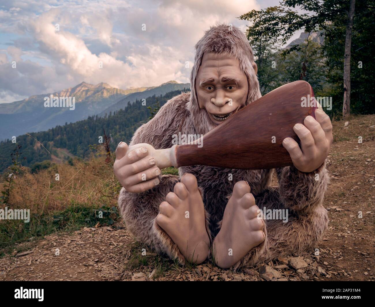 Yeti is eating meat in the forest Krasnaya Polyana Sochi 09/01/2018 ...
