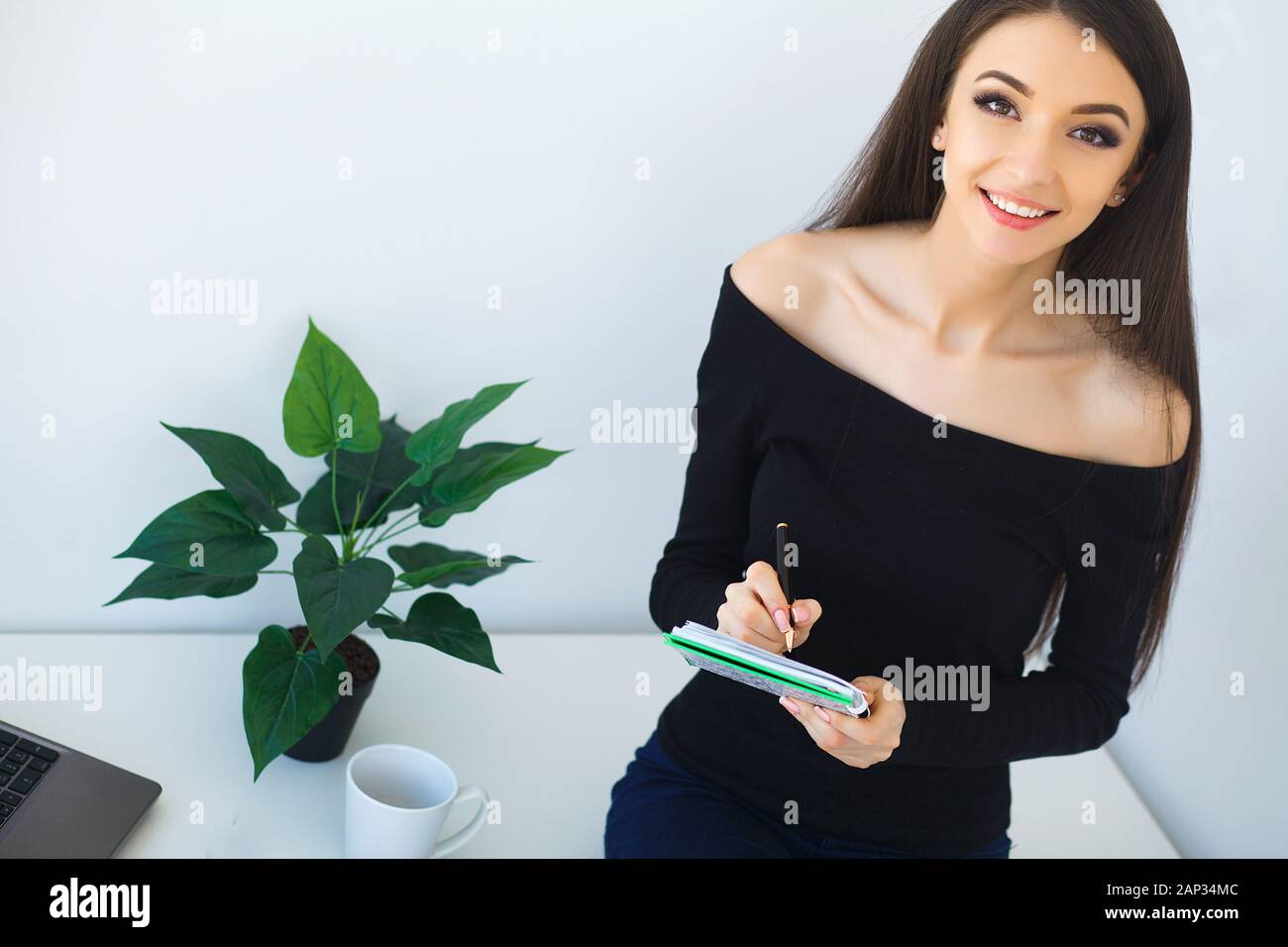 Beautiful young girl working on computer at home Stock Photo - Alamy