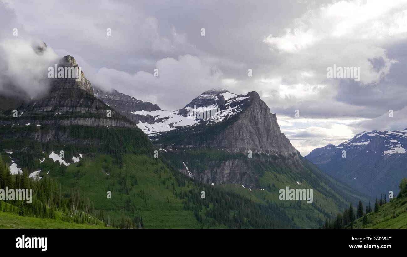 clouds at mt oberlin in glacier national park Stock Photo - Alamy