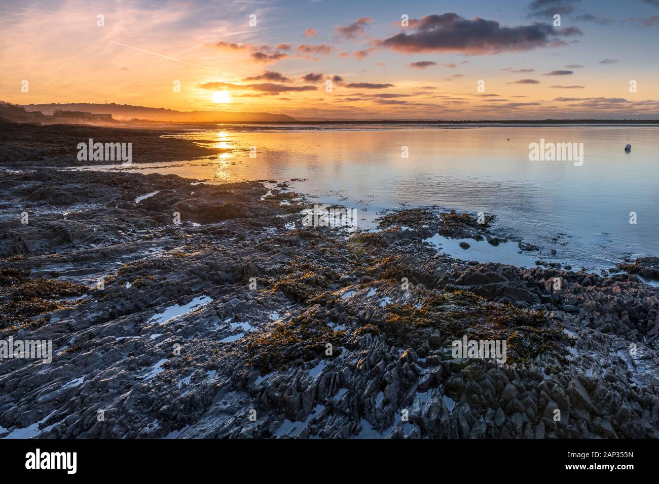 The sun sets over Northam Burrows near Appledore in North Devon. The River Torridge estuary and ...