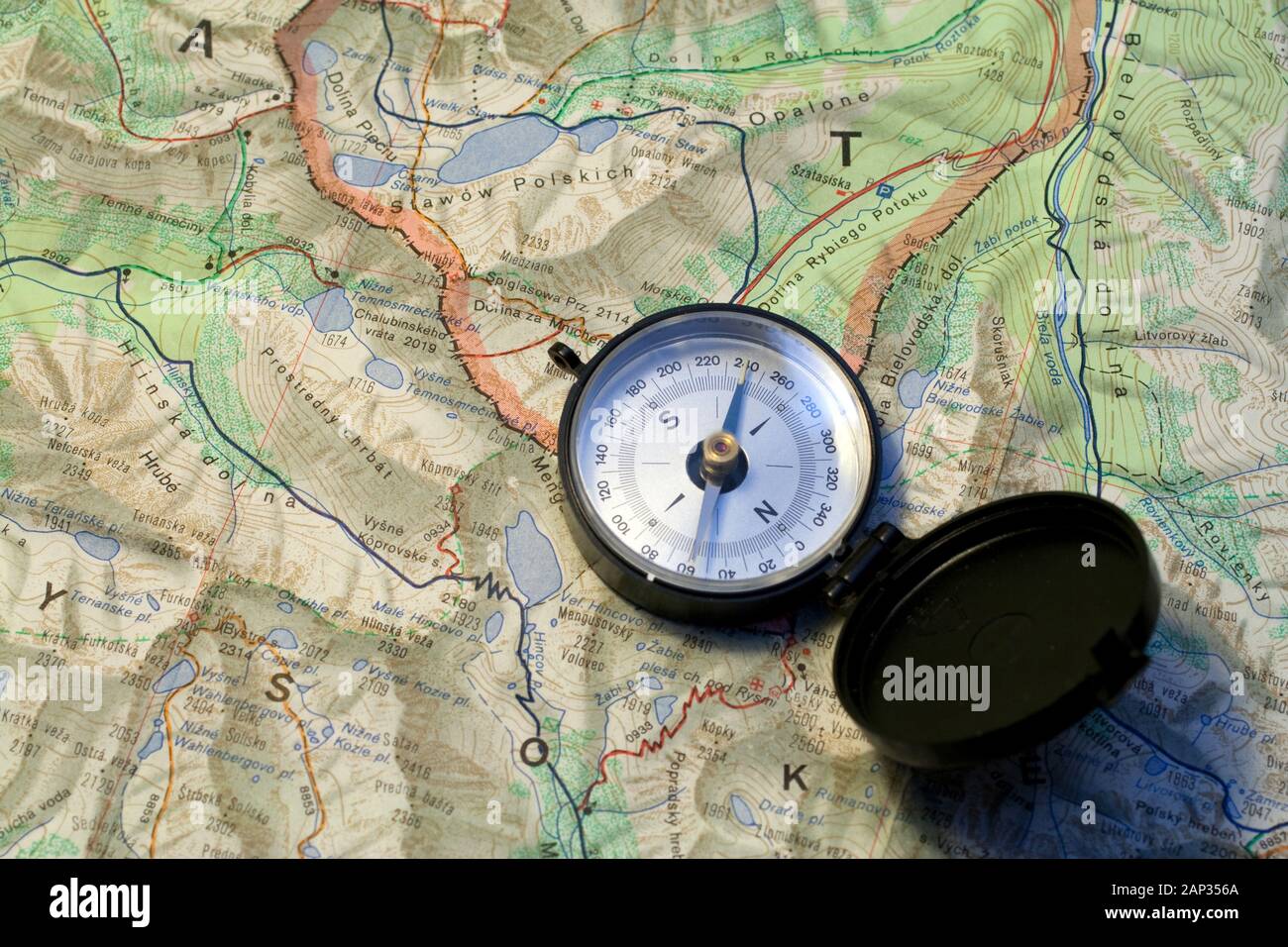 Compass on a topographic map Stock Photo - Alamy