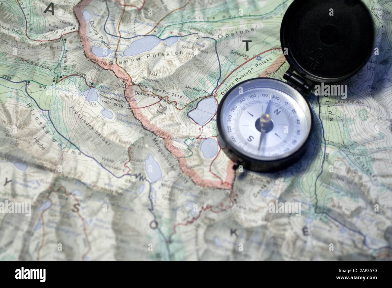 Compass on a topographic map Stock Photo - Alamy