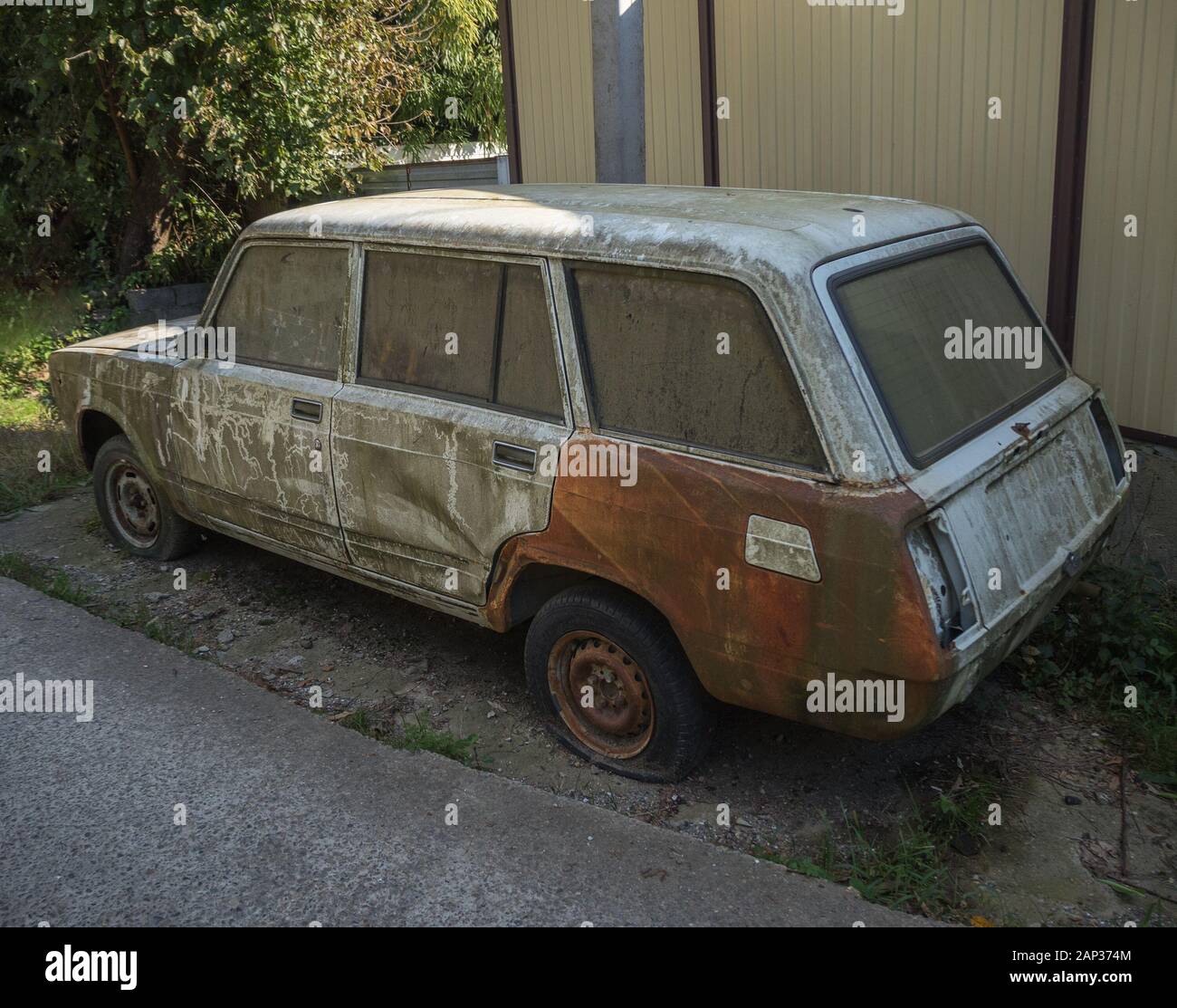 Old dirty rusty russian car Stock Photo - Alamy