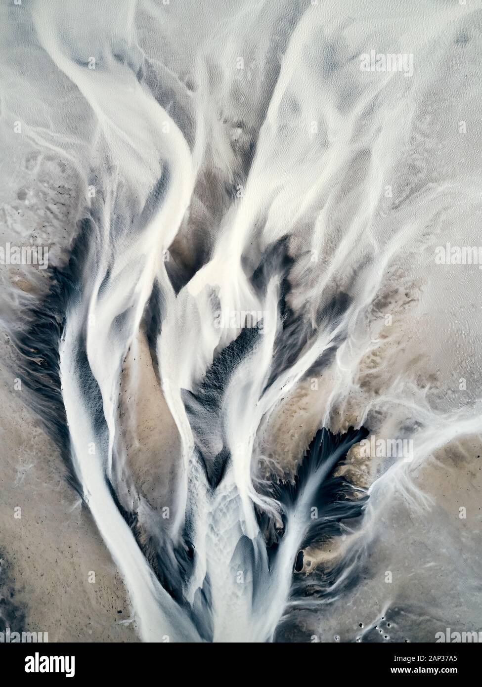 Amazing aerial view of abstract texture of cold frozen delta river ...
