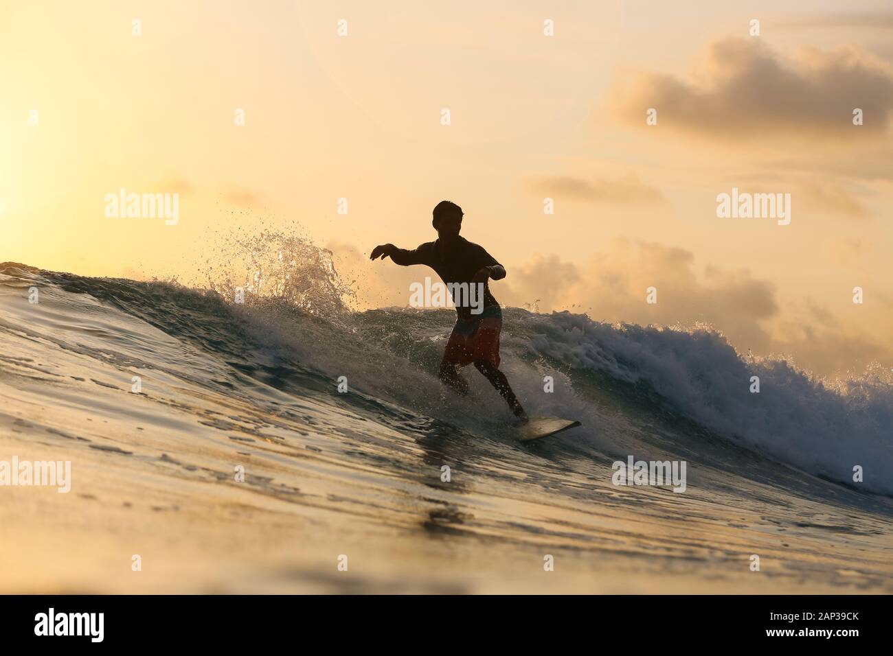 Asian man surfing ocean hi-res stock photography and images - Alamy