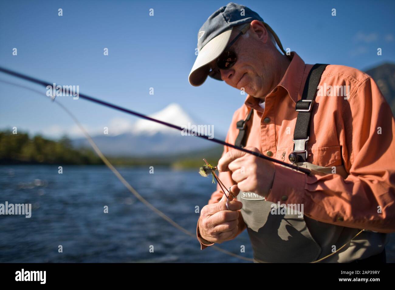 Man fishing in river Stock Photo - Alamy