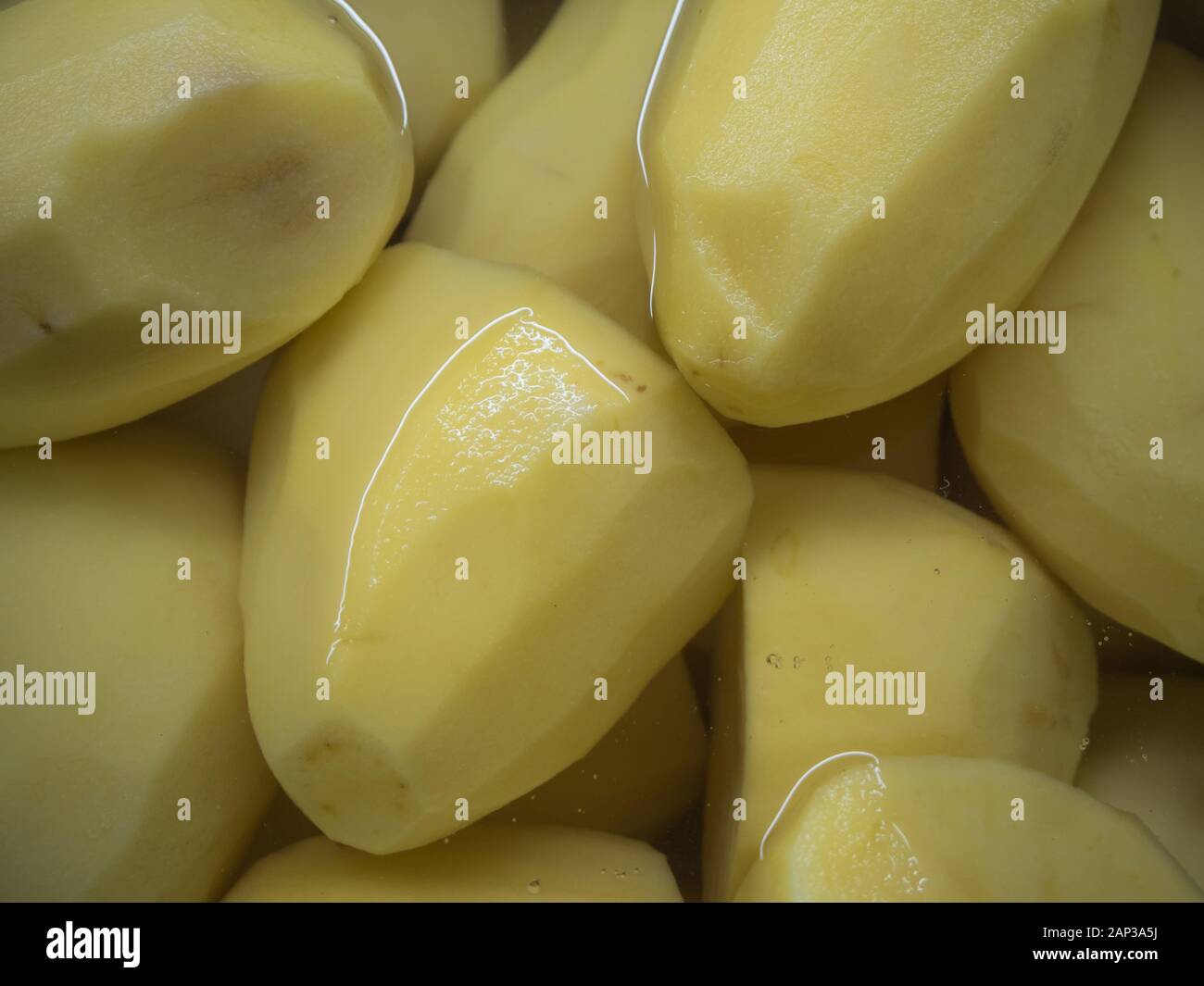 Cleaned Potatoes in Water Stock Photo - Alamy