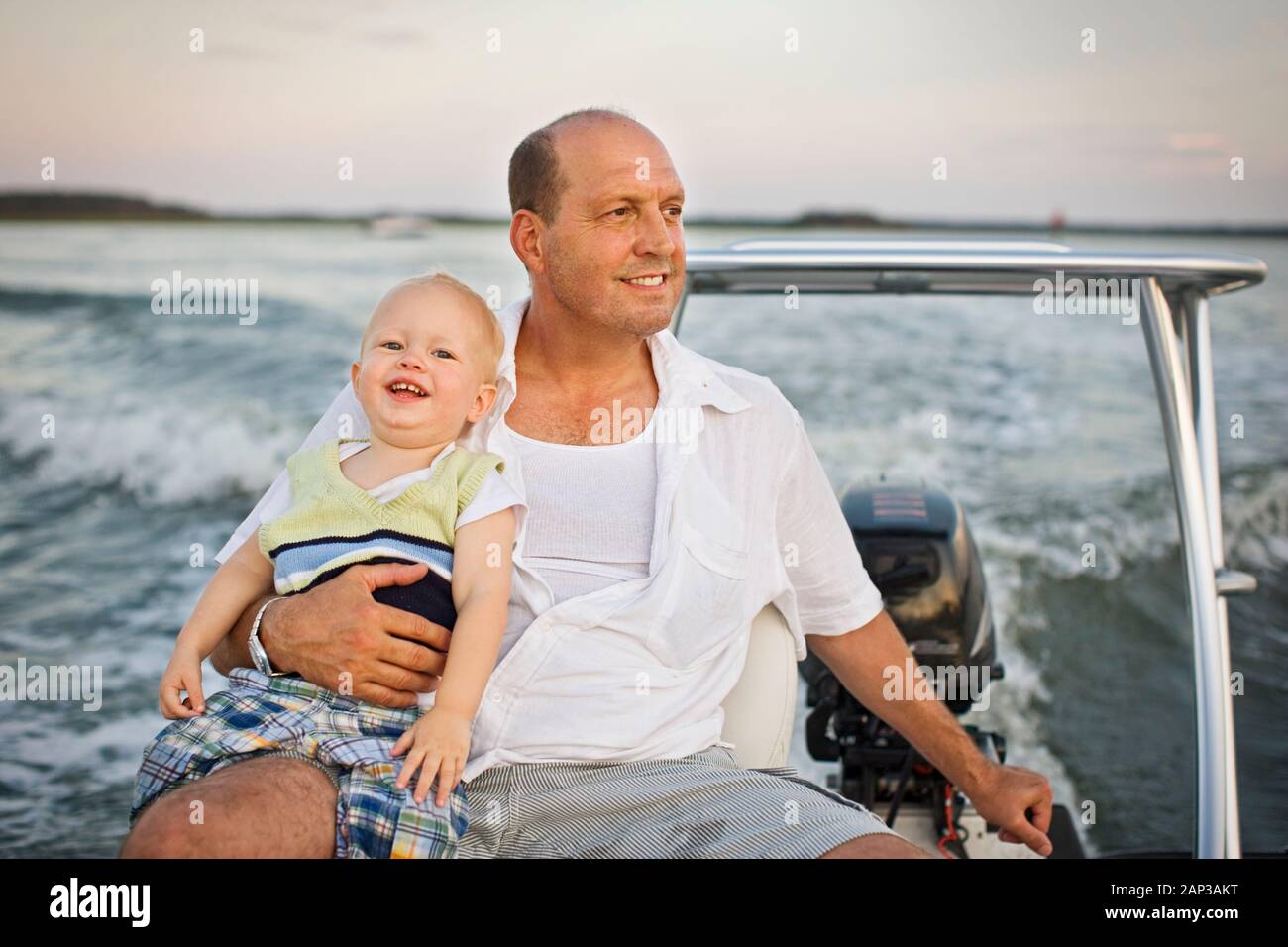Father and baby son on a boat Stock Photo - Alamy
