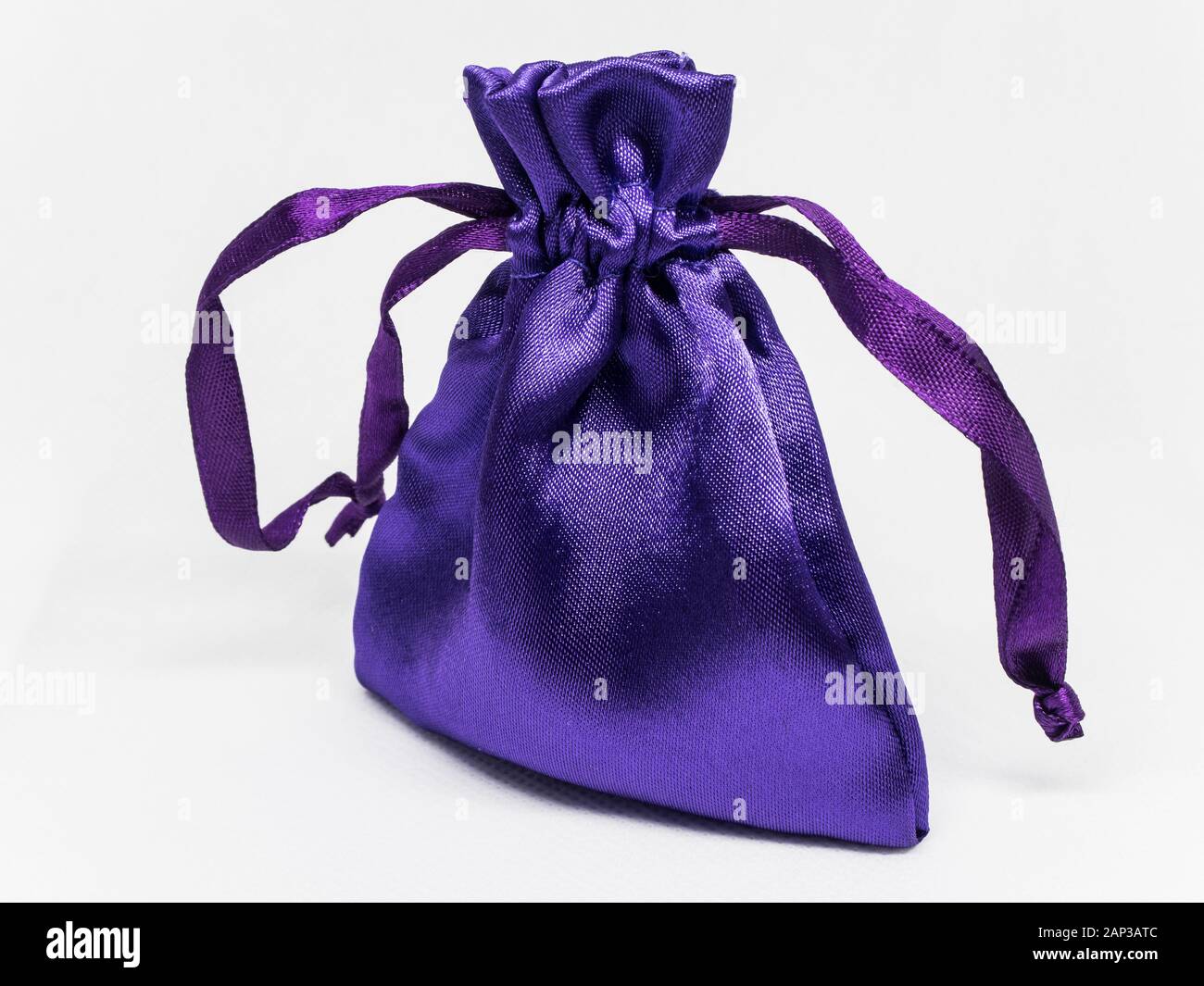Purple bag on a light background Stock Photo - Alamy