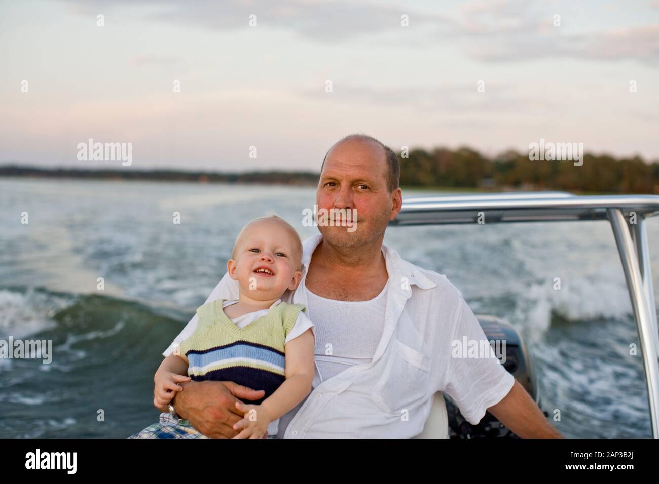 Happy baby boy holding water hi-res stock photography and images - Alamy