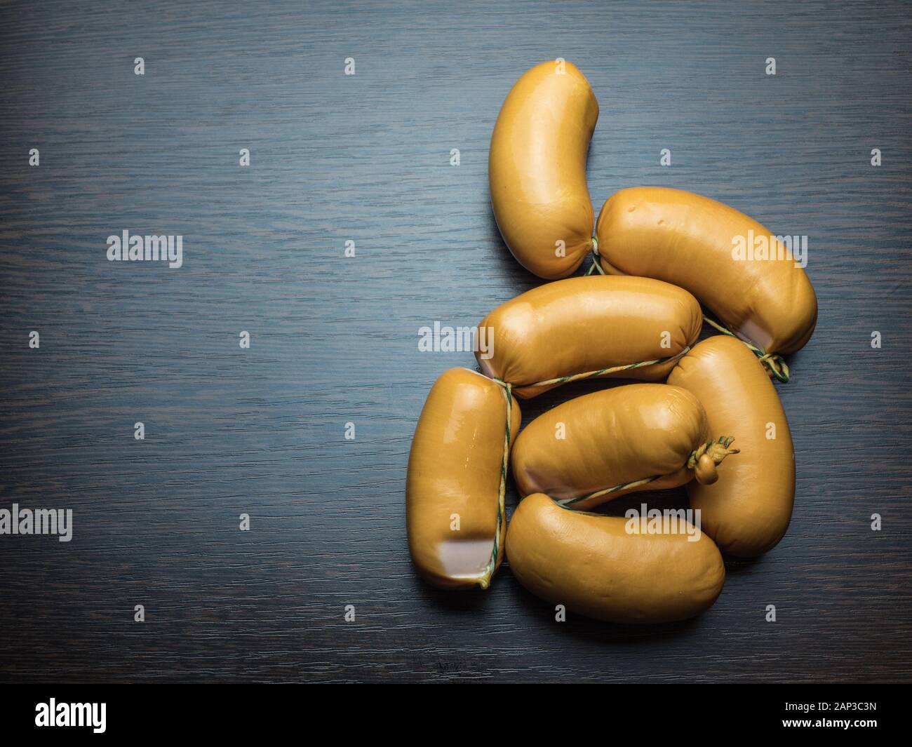 A group of wieners on a wood background Stock Photo - Alamy