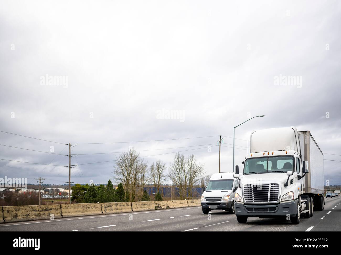 Big rig white day cab semi truck with efficient eco-friendly diesel ...