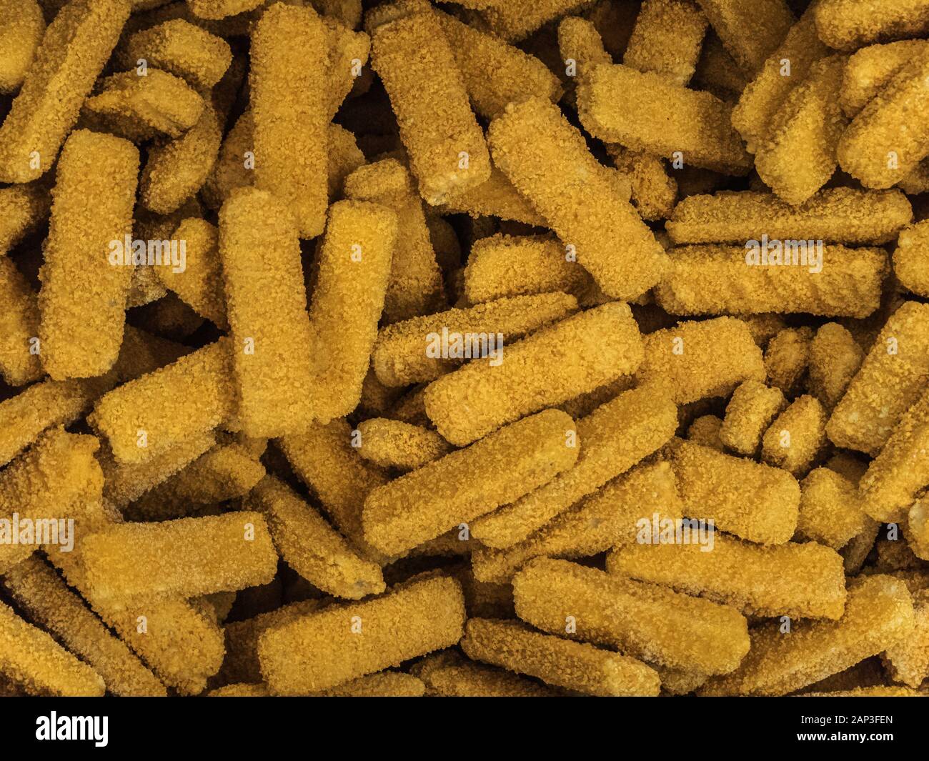 Frozen chicken sticks breaded in the freezer in the store Stock Photo ...