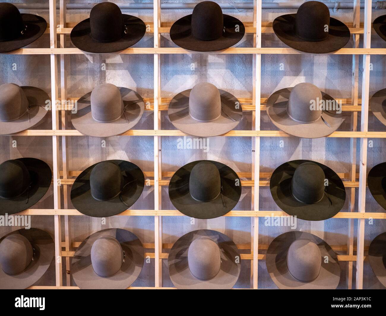 Wall display of various shapes and colors of hats in retail store Stock ...