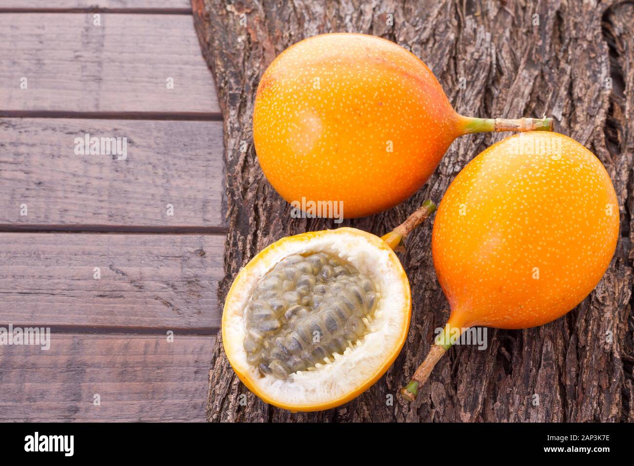 Passion fruit granadilla on the table - Passiflora ligularis Stock ...