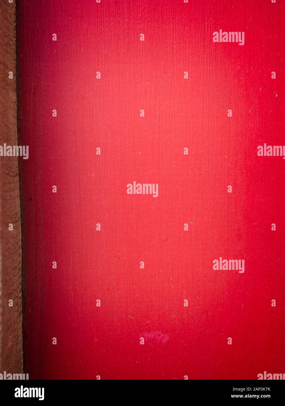 Colorful red painted textured wall of building enclave for abstract ...