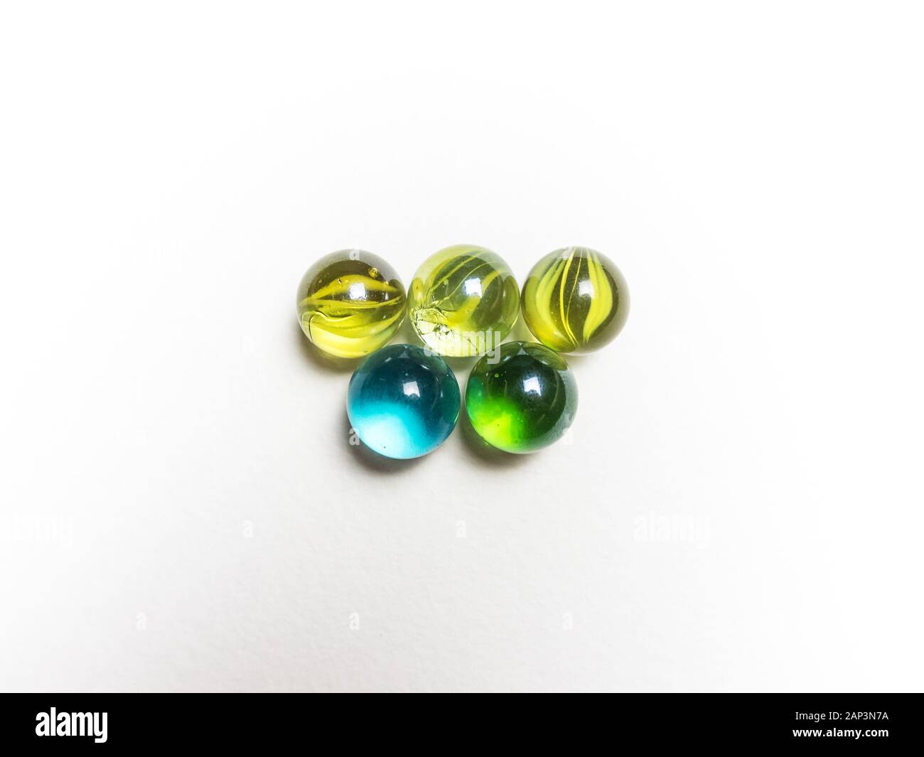 Five colored glass balls with caustics on white background Stock Photo ...