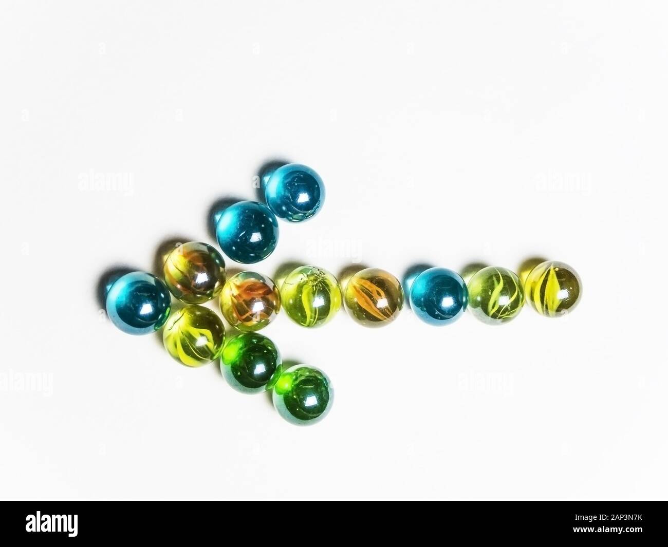 Arrow from caustic glass balls on white background Stock Photo - Alamy