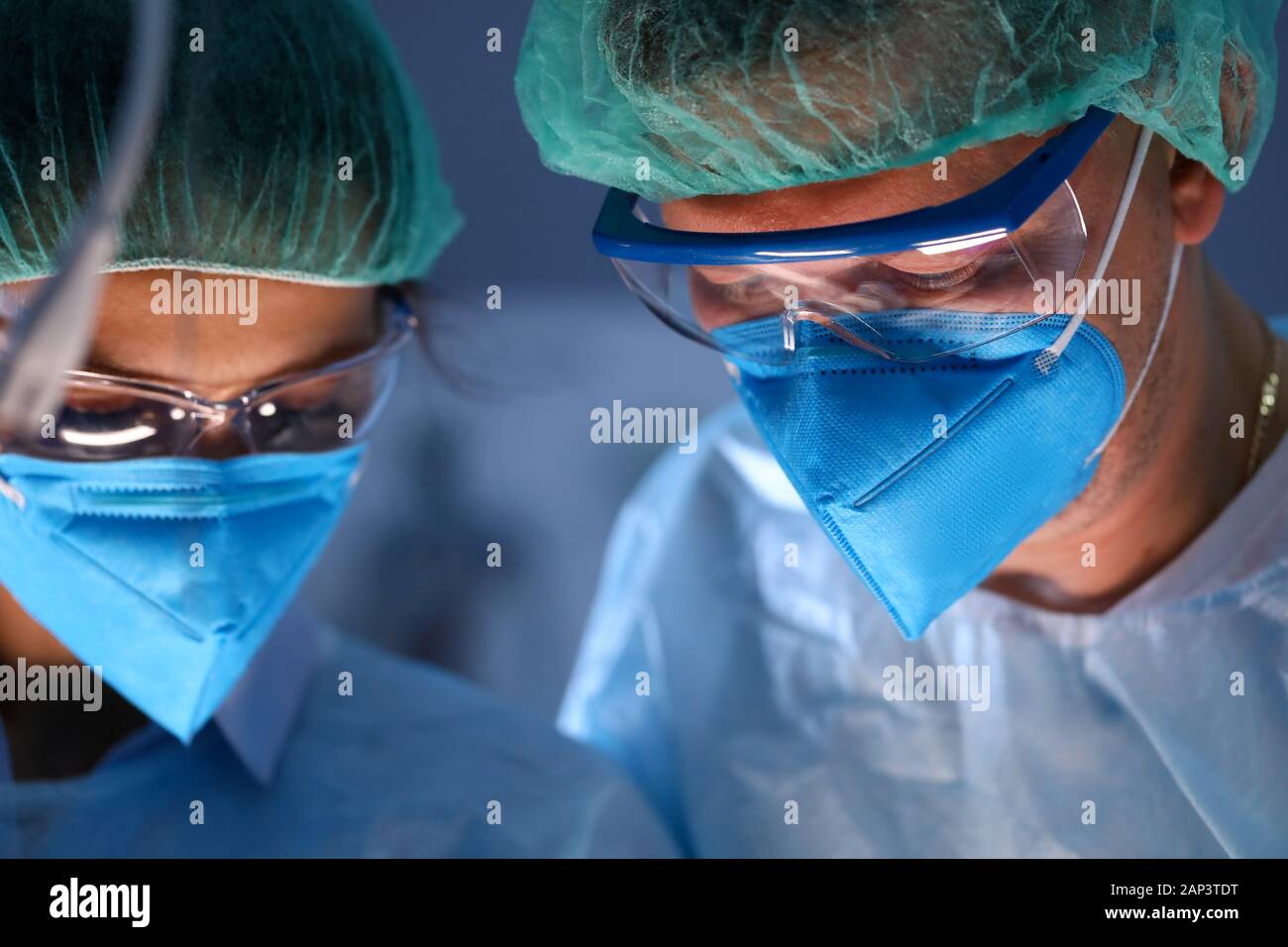 Doctors doing surgery Stock Photo - Alamy