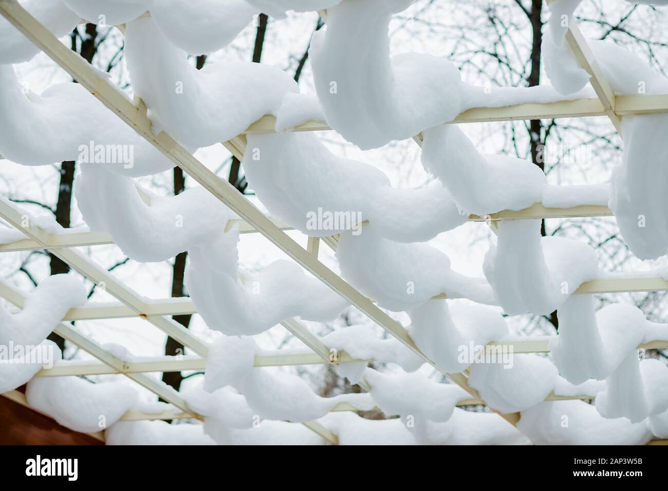 Closeup of wooden deck fence railing side, pole, post covered, in piled ...