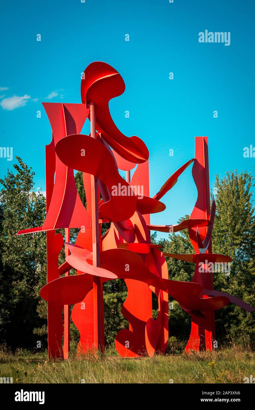 Giant red statue in a field at the Frederik Meijer Gardens Stock Photo ...